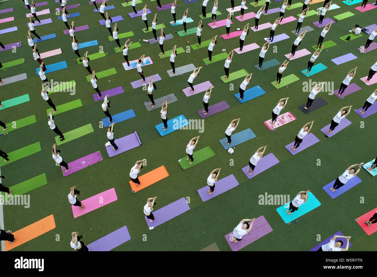 Thousands of Chinese yoga lovers practice yoga to mark the upcoming ...