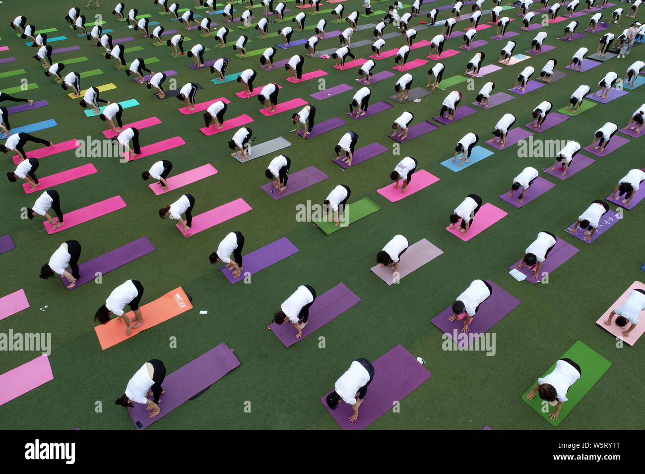 Thousands of Chinese yoga lovers practice yoga to mark the upcoming ...