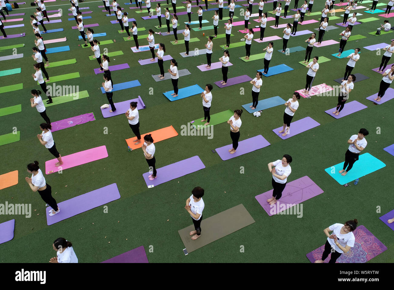 Thousands of Chinese yoga lovers practice yoga to mark the upcoming ...