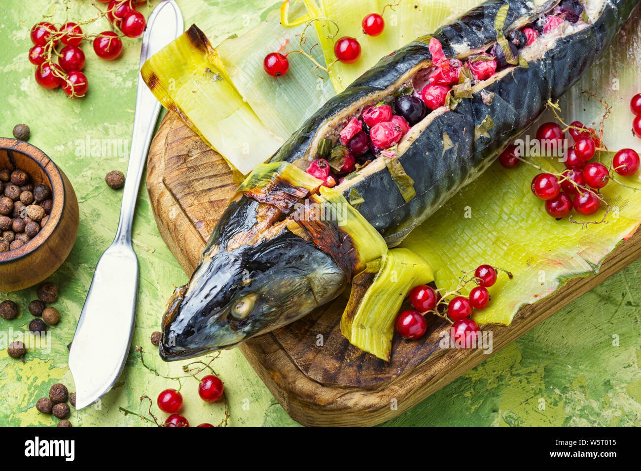 Baked mackerel stuffed with berries.Fish with currant filling.Seafood ...
