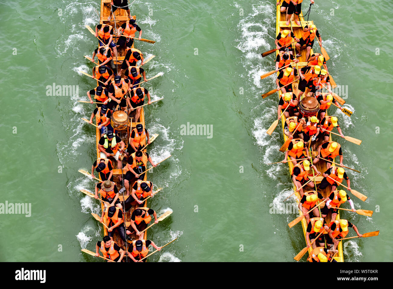 Competitors take part in a dragon boat race to celebrate the Chinese ...
