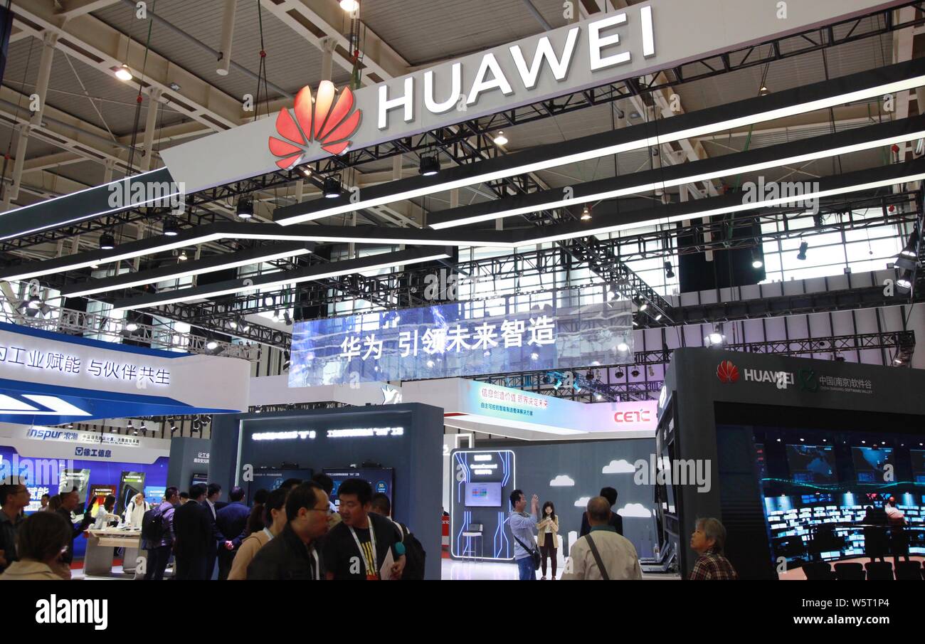 --FILE--People visit the stand of Huawei during an expo in Nanjing city ...