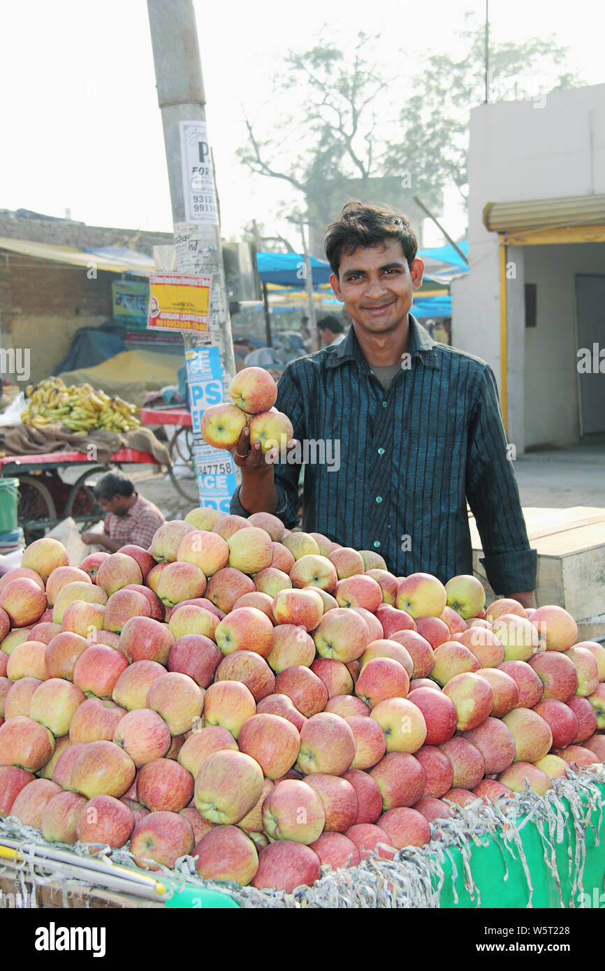 Vendor selling apples market hi-res stock photography and images - Alamy