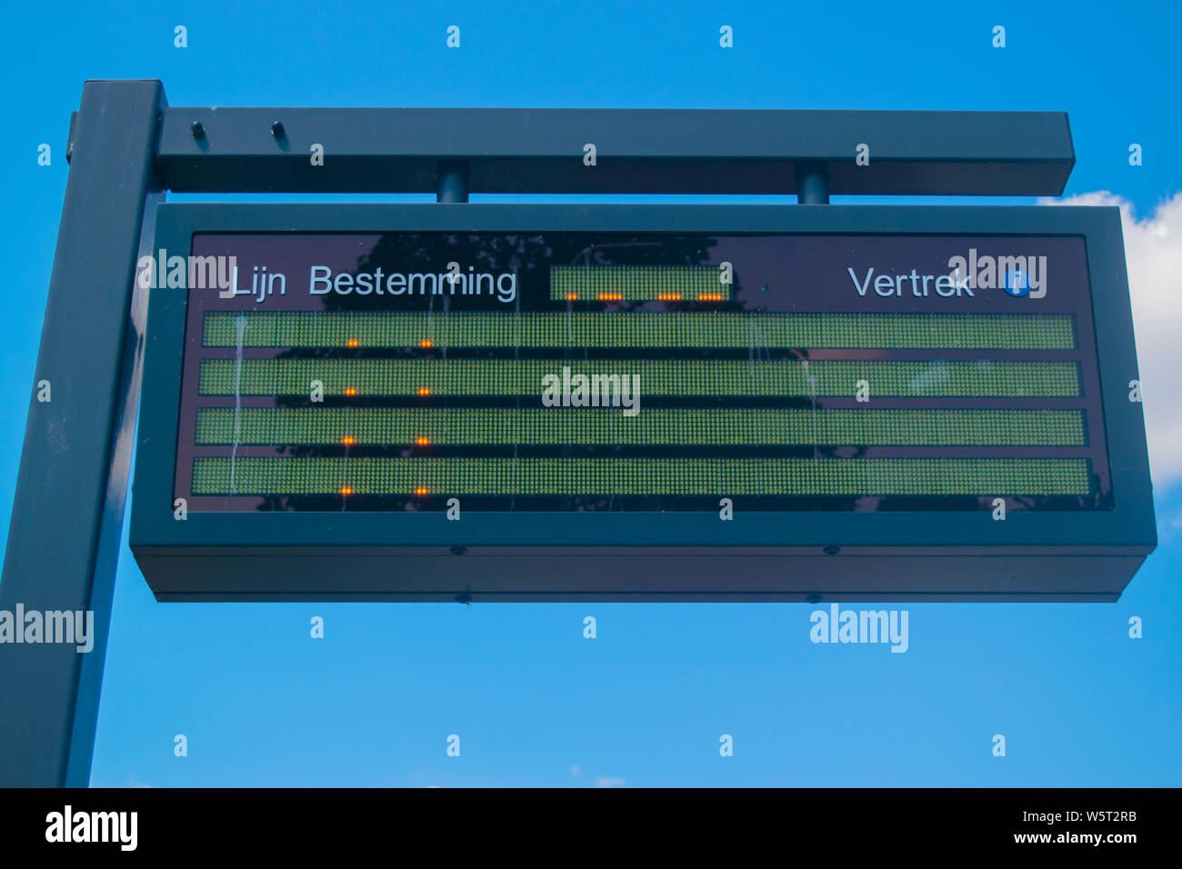 Information panel with Dutch bus departure times,electronic bulletin ...