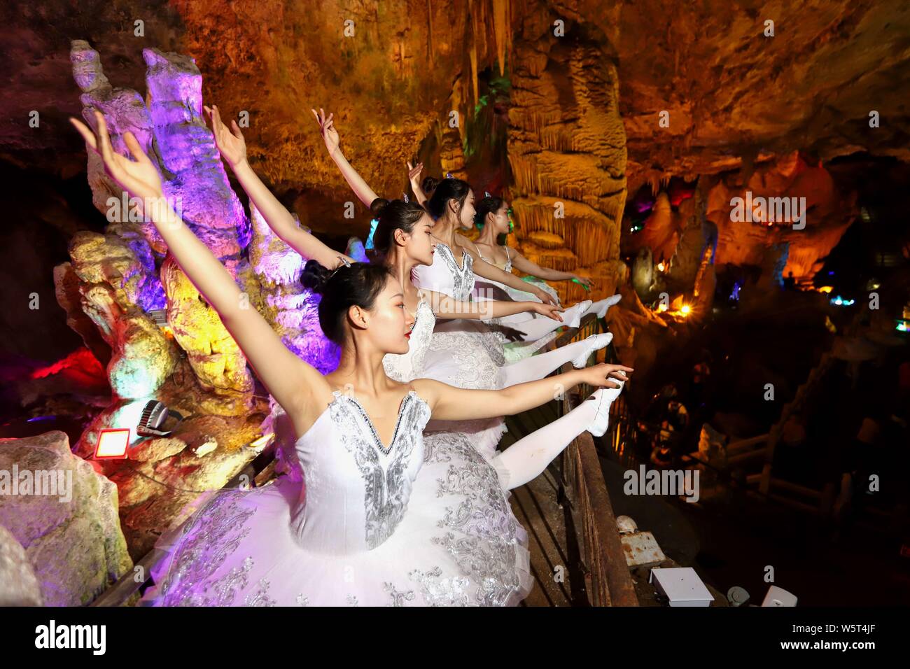 Chinese girls perform ballet in a karst cave as part of the opening ...