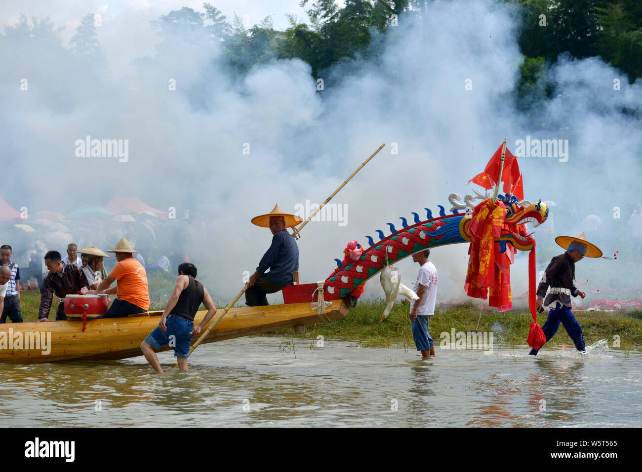Chinese people of Miao ethnic minority take part in a dragon race ...
