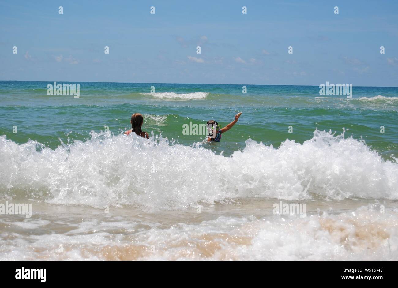 Fun in the Waves Stock Photo - Alamy