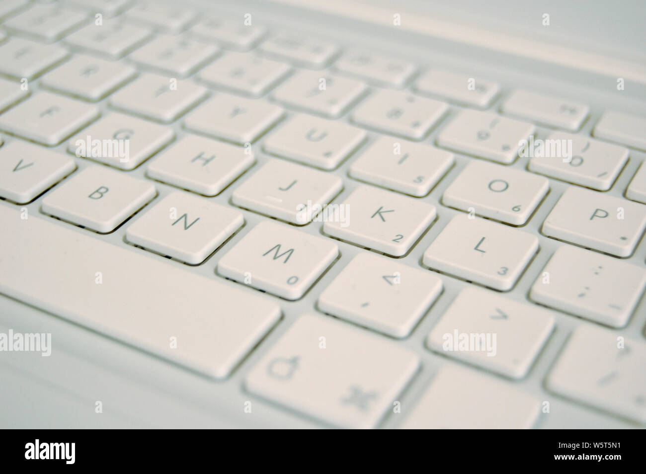 Modern white keyboard, white famous brand model Stock Photo - Alamy