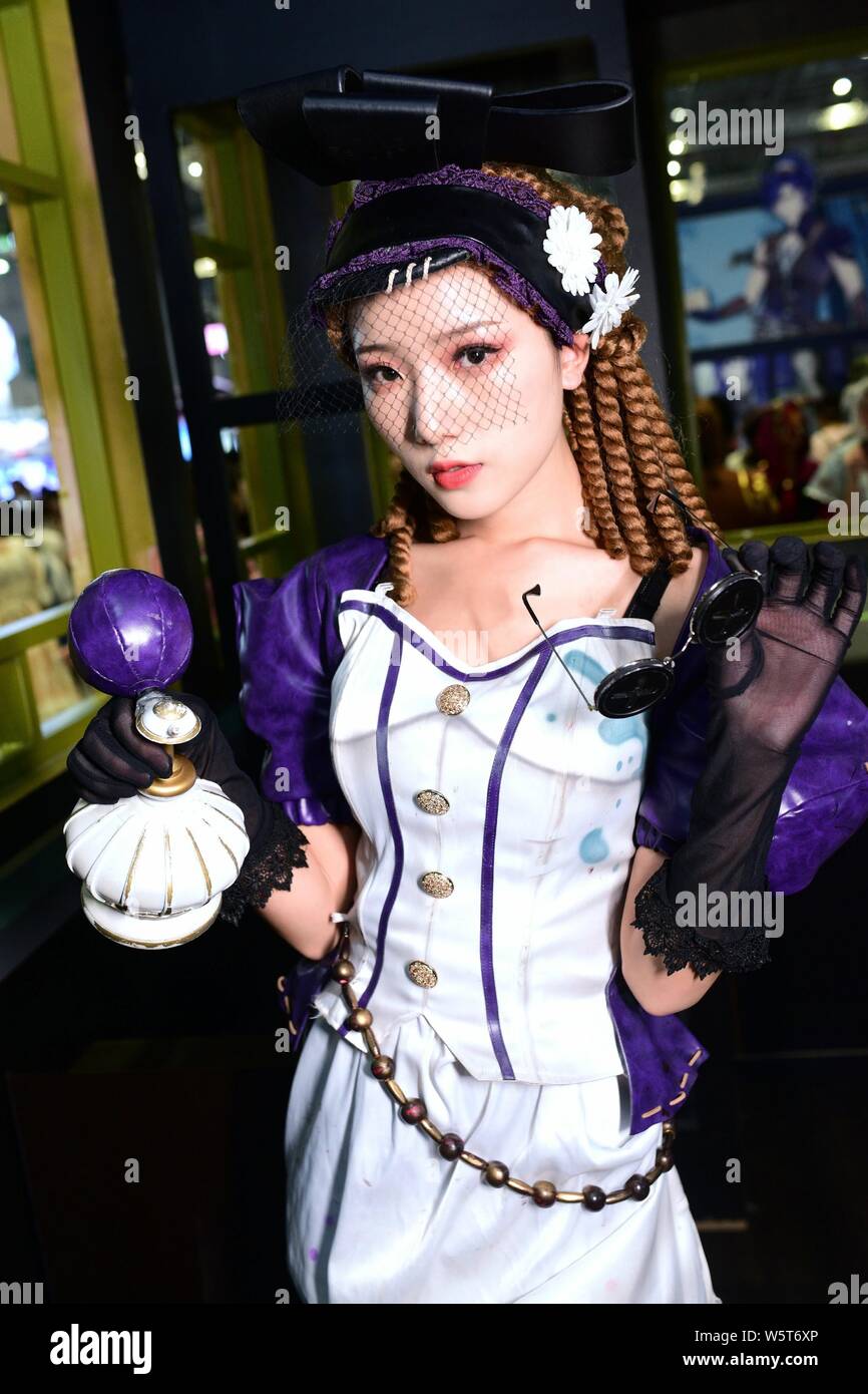 An entertainer dressed in cosplay costume poses during the Shanghai ...