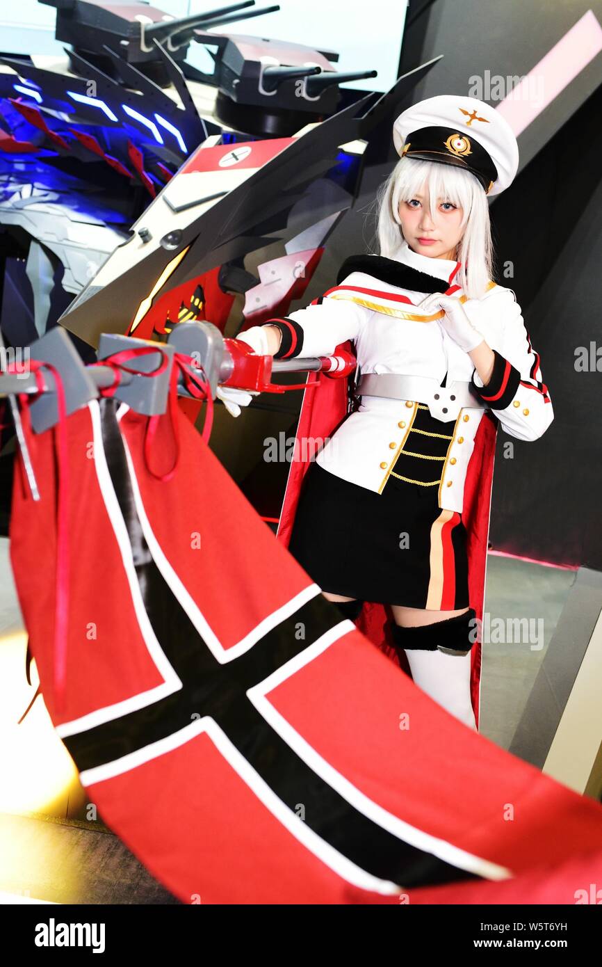 An entertainer dressed in cosplay costume poses during the Shanghai ...