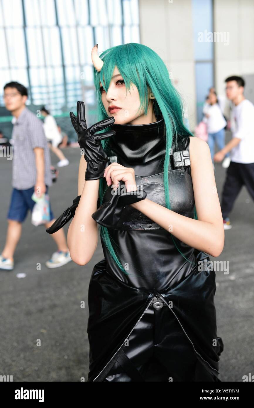 An entertainer dressed in cosplay costume poses during the Shanghai ...