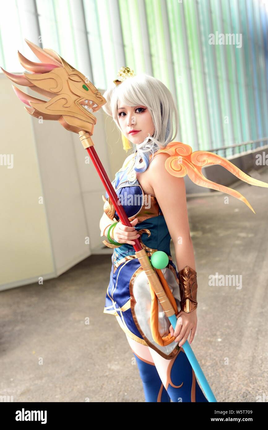 An entertainer dressed in cosplay costume poses during the Shanghai ...