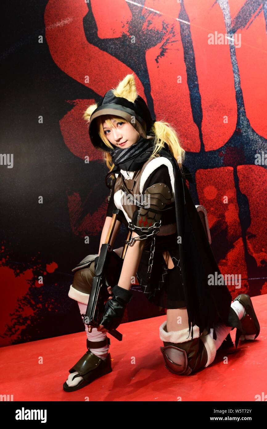 An entertainer dressed in cosplay costume poses during the Shanghai ...