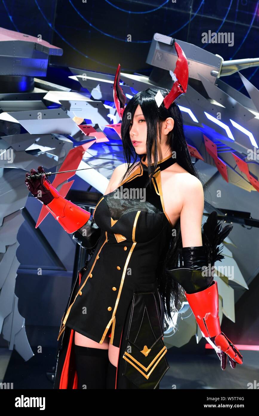An entertainer dressed in cosplay costume poses during the Shanghai COMICUP 24 Cosplay Showcase ...