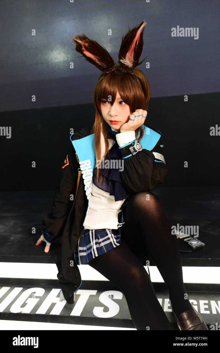An entertainer dressed in cosplay costume poses during the Shanghai ...