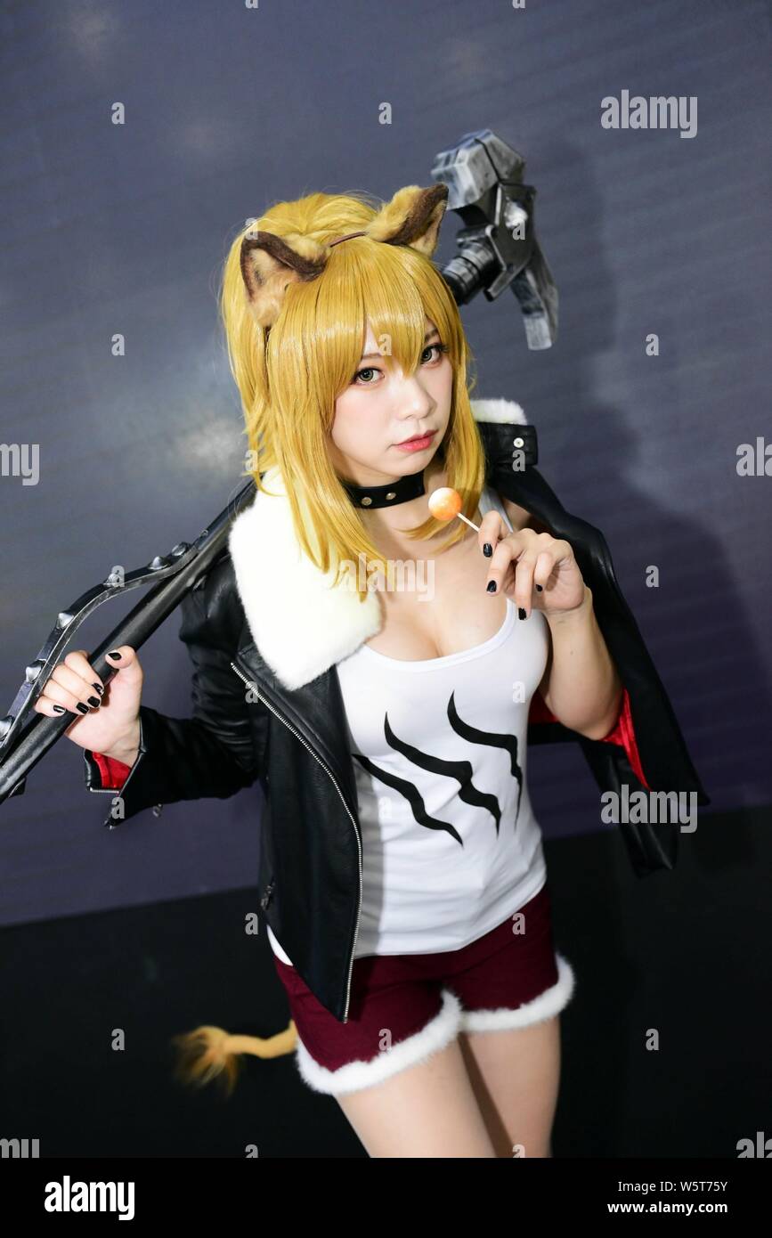 An entertainer dressed in cosplay costume poses during the Shanghai ...