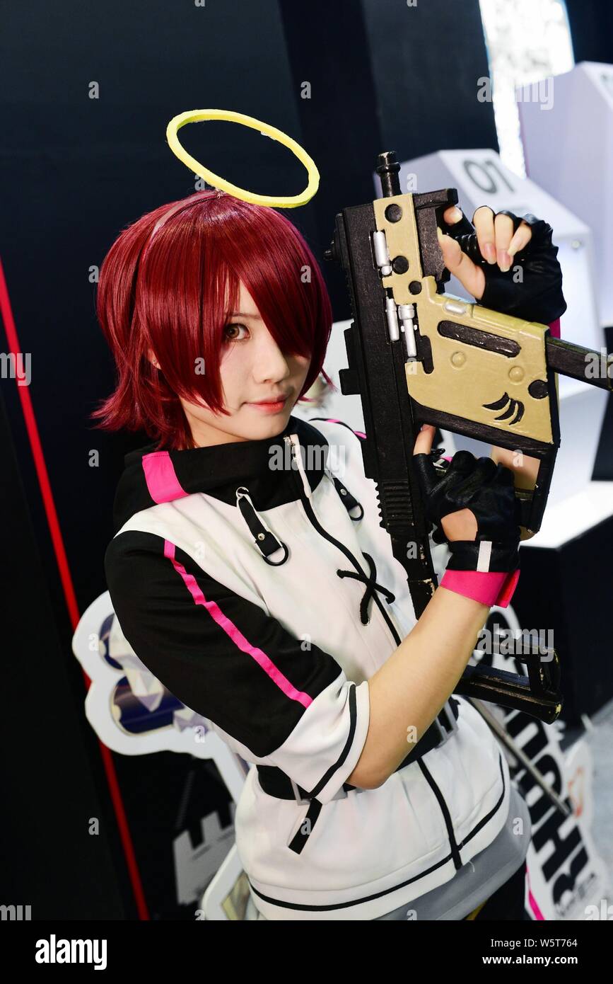 An entertainer dressed in cosplay costume poses during the Shanghai ...