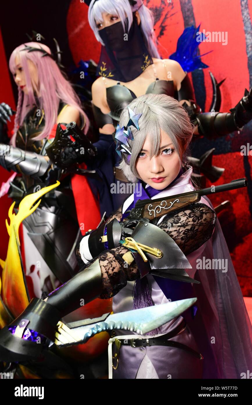 An entertainer dressed in cosplay costume poses during the Shanghai ...