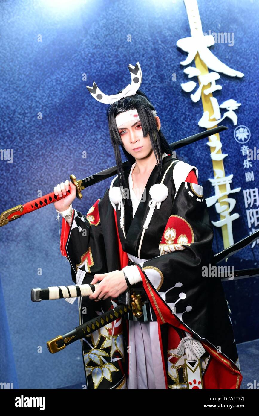 An entertainer dressed in cosplay costume poses during the Shanghai ...