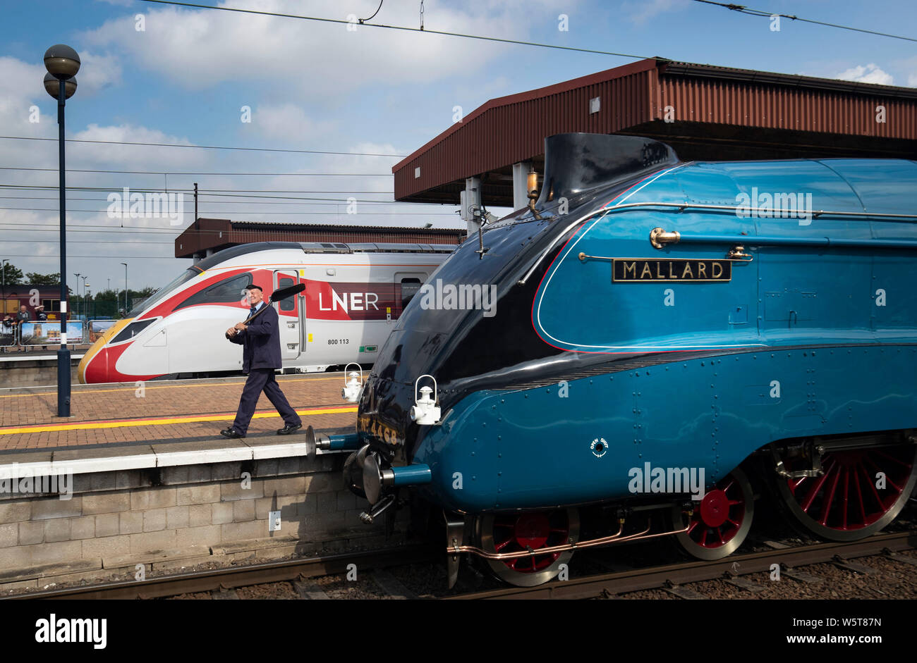 Steam traction inspector Jim Smith is pictured with a new Azuma train ...