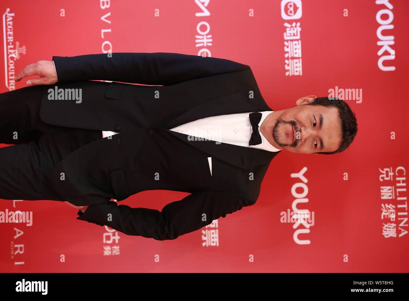 Chinese actor Liao Fan arrives on the red carpet for the opening ...
