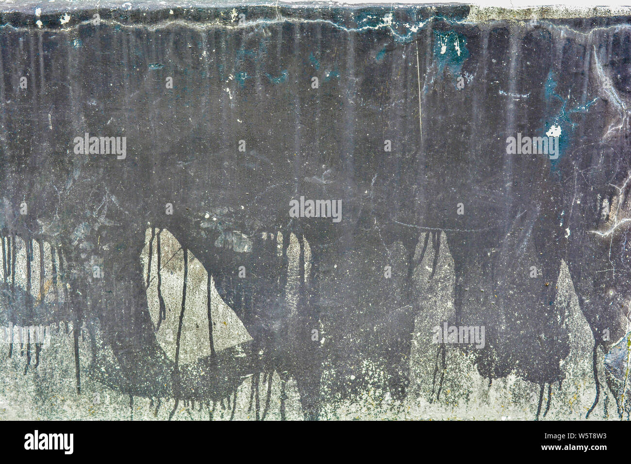 Texture of dirty destroyed concrete wall with black paint and dirt ...