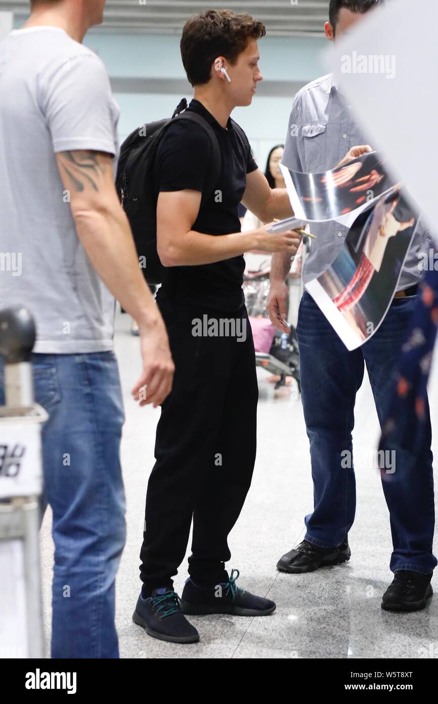 English actor and dancer Tom Holland signs autographs for fans as he ...