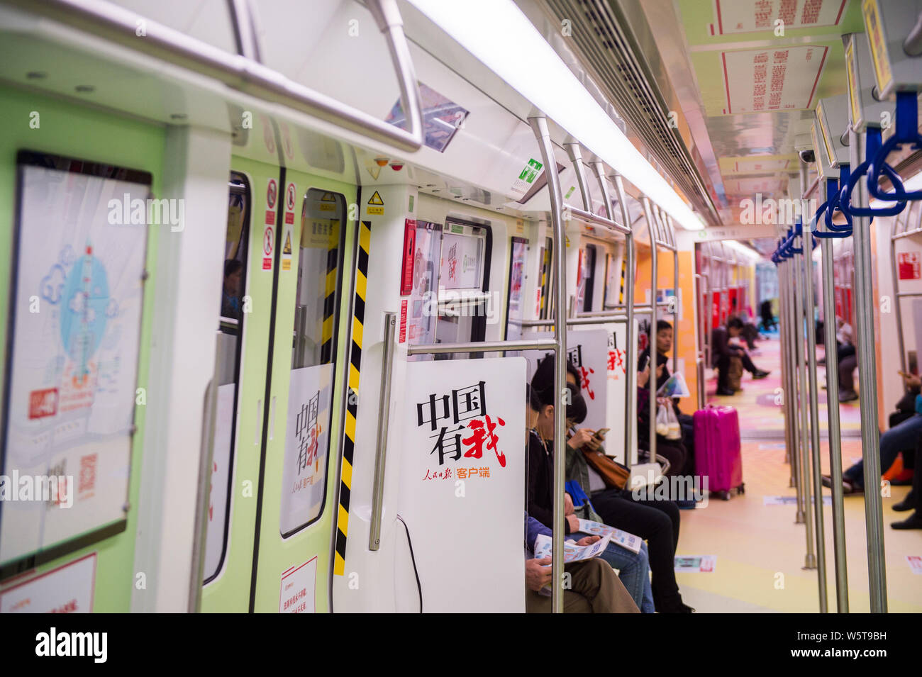 Chinese commuters sit in a themed subway train of Shenzhen Metro Line 1 ...