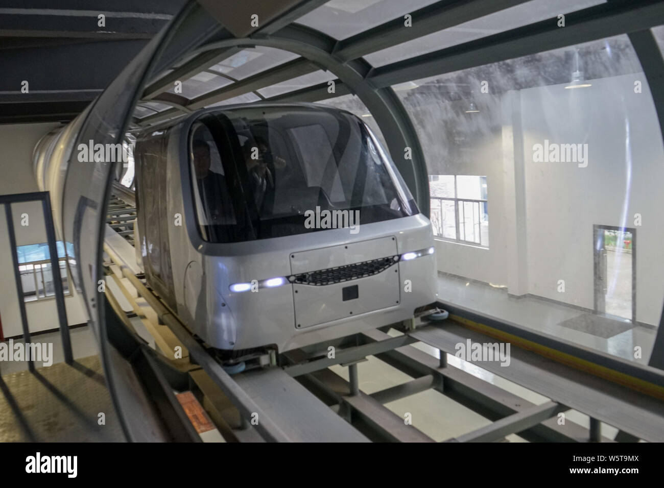 An unmanned electric vehicle runs in the 350-meter-long tubenet transit ...