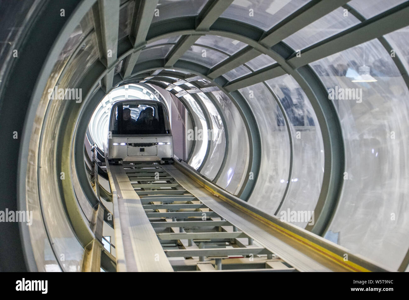 An unmanned electric vehicle runs in the 350-meter-long tubenet transit ...