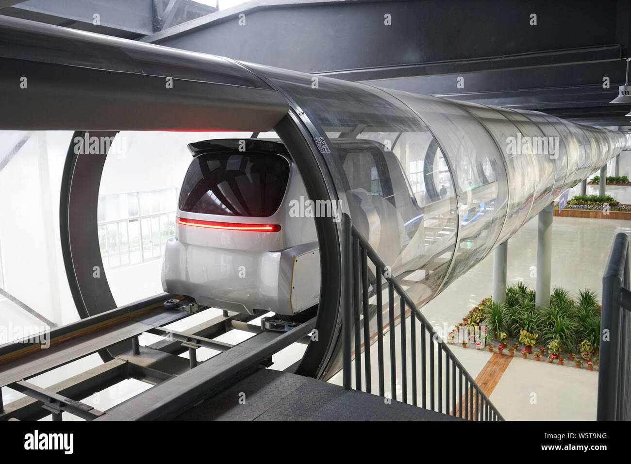 An unmanned electric vehicle runs in the 350-meter-long tubenet transit ...