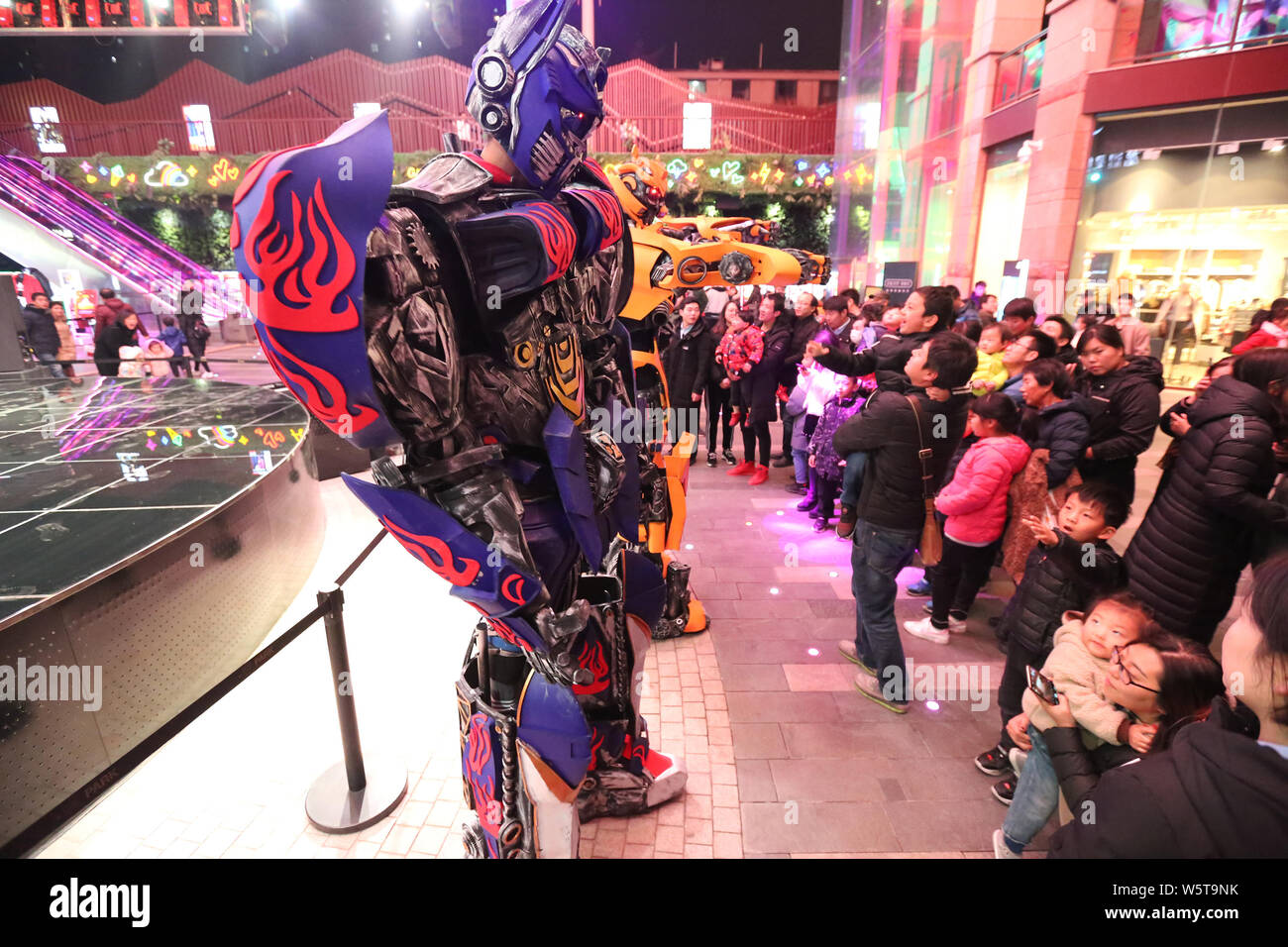 A college student wearing a two-meter-high life-size replica of ...