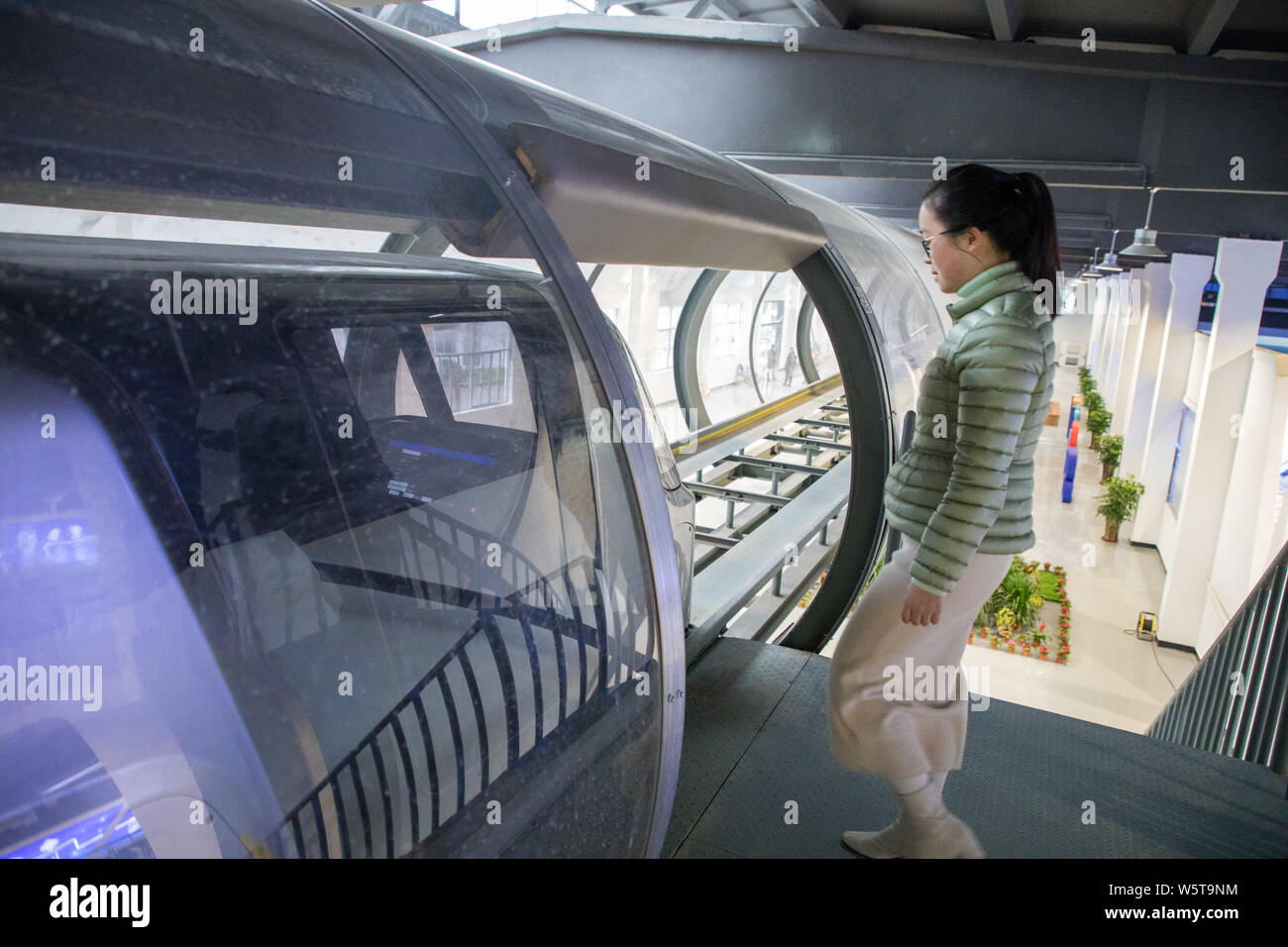 An unmanned electric vehicle runs in the 350-meter-long tubenet transit ...