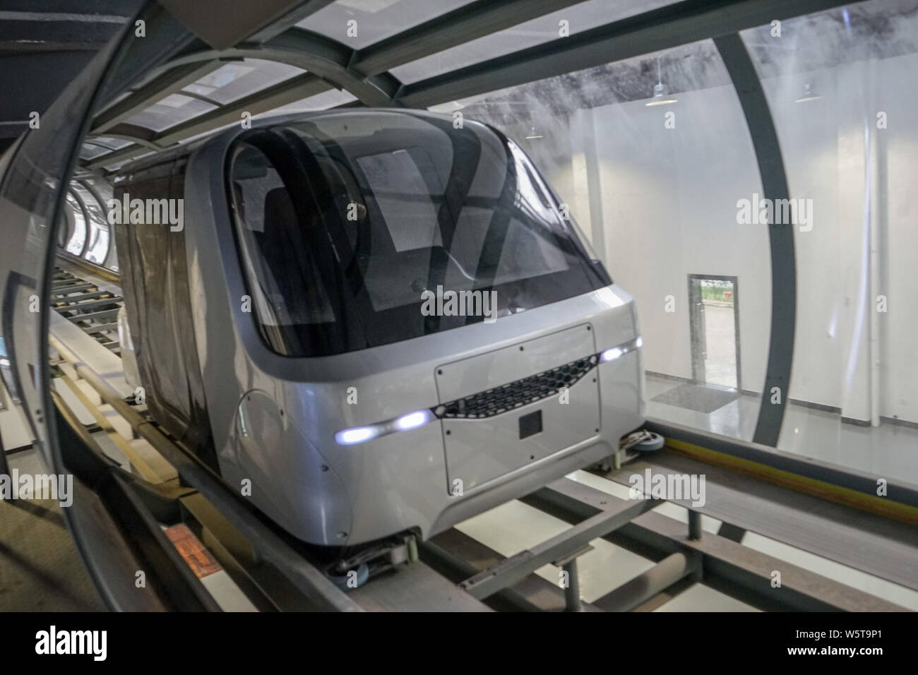 An unmanned electric vehicle runs in the 350-meter-long tubenet transit ...