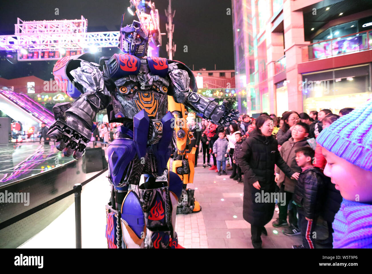 A college student wearing a two-meter-high life-size replica of ...