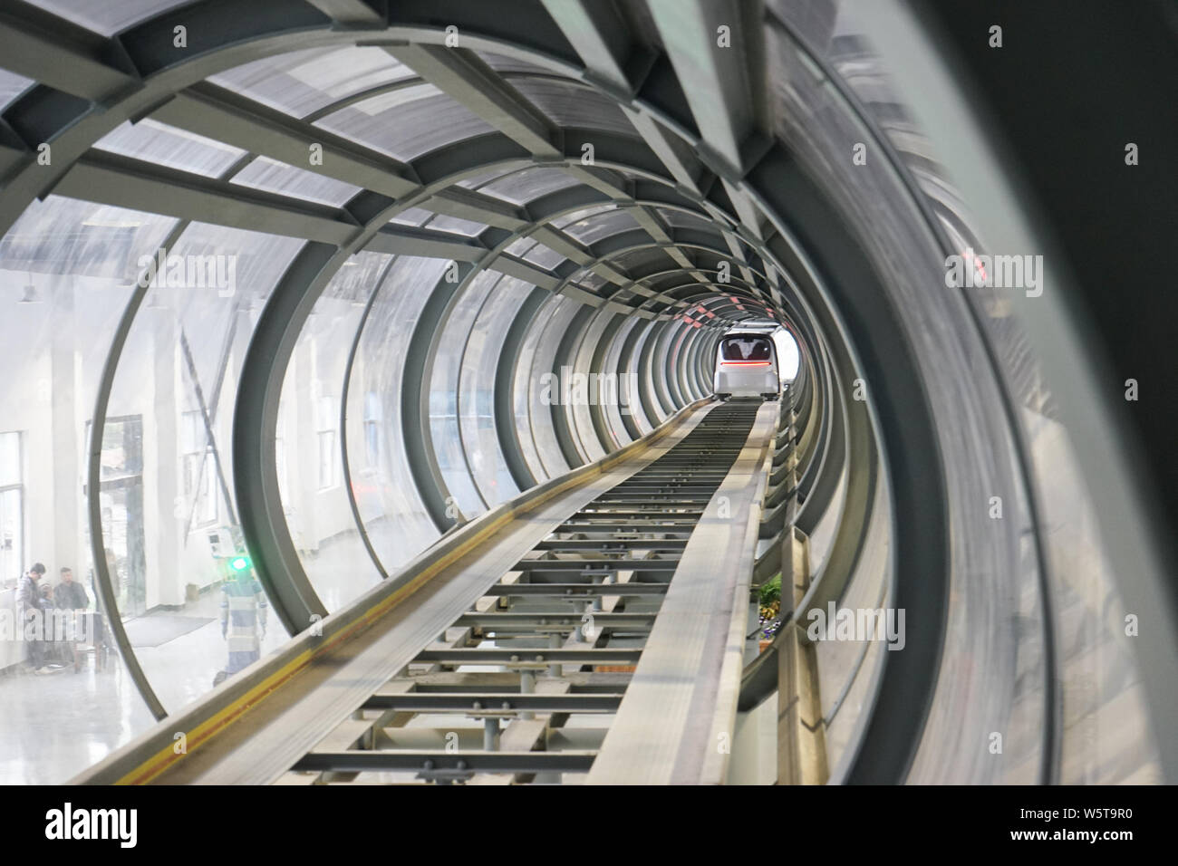 An unmanned electric vehicle runs in the 350-meter-long tubenet transit ...