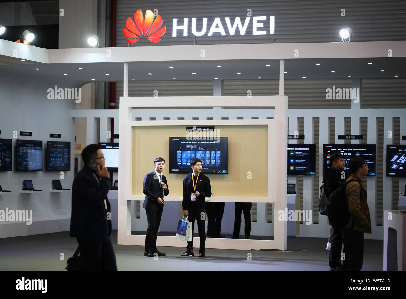 --FILE--People visit the stand of Huawei during an expo in Kunming city ...