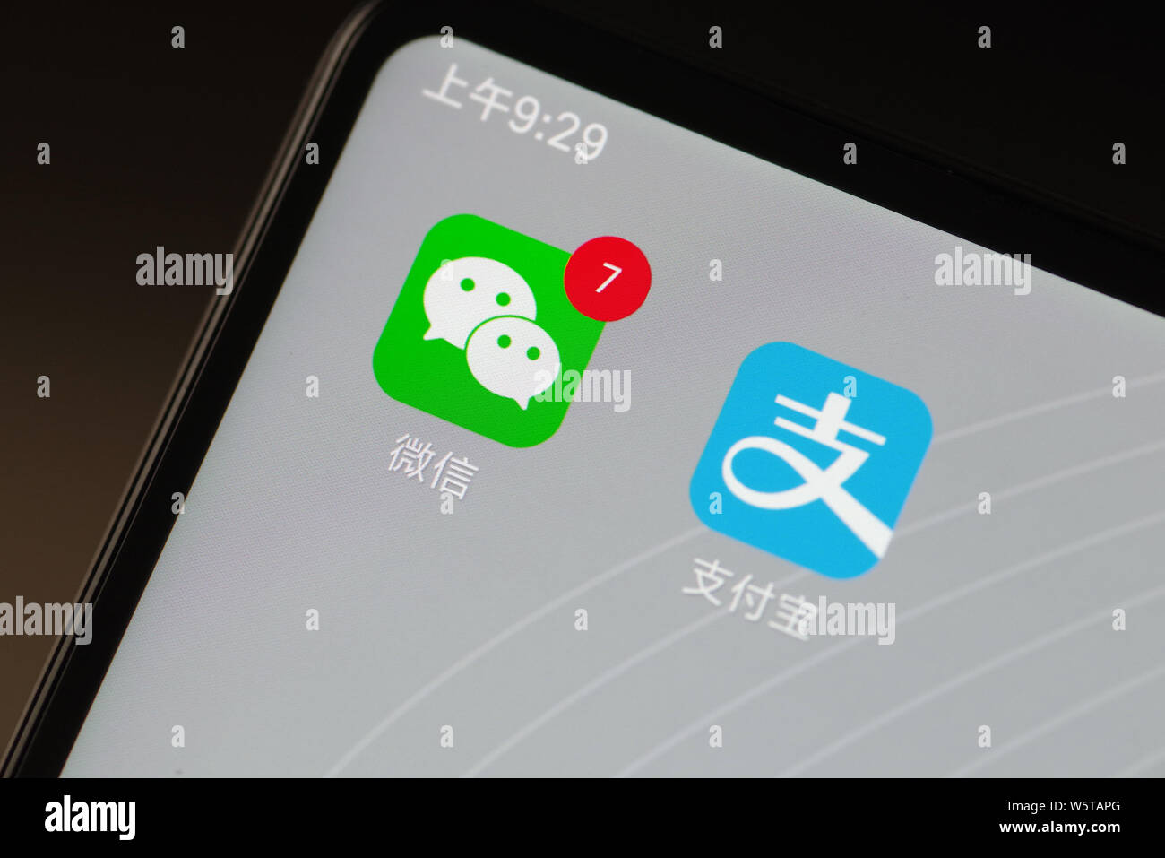 --FILE--A Chinese mobile phone user shows the icons of messaging app ...