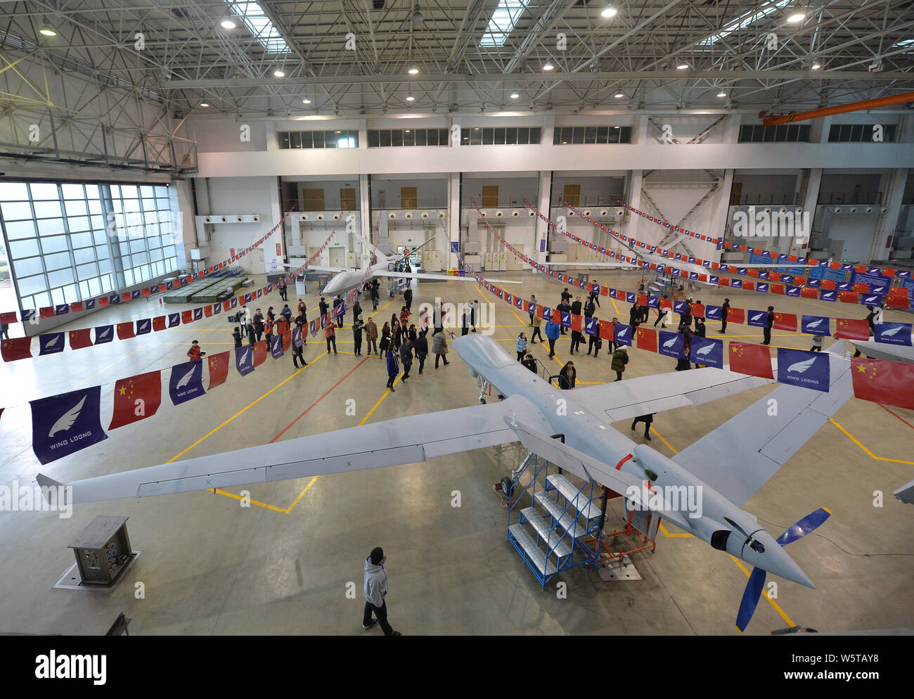 --FILE--Visitors view Wing Loong unmanned aerial vehicles (UAV) at the ...
