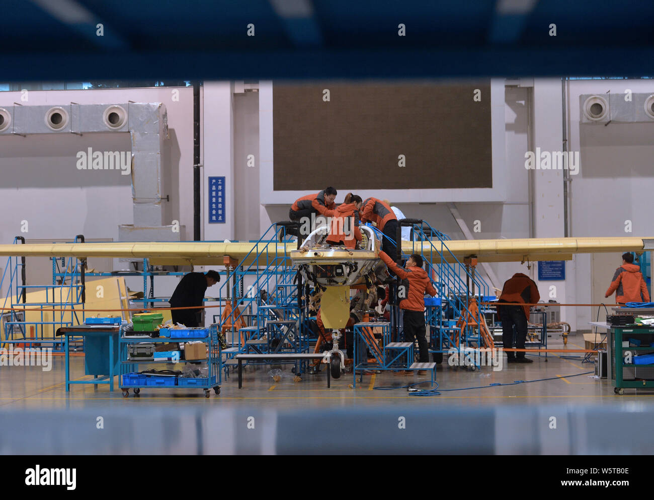 --FILE--Chinese workers assemble a Wing Loong unmanned aerial vehicle ...