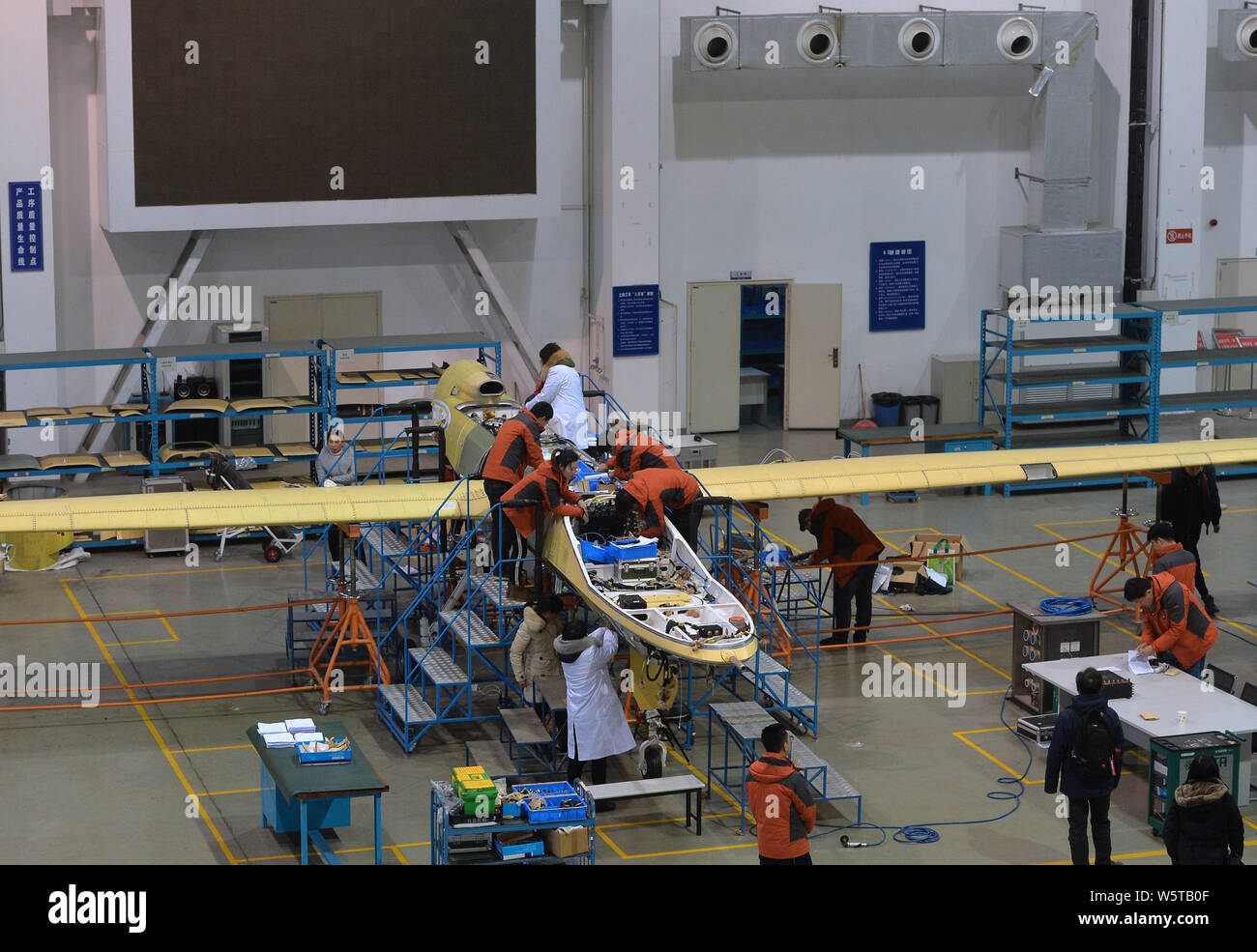 --FILE--Chinese workers assemble a Wing Loong unmanned aerial vehicle ...