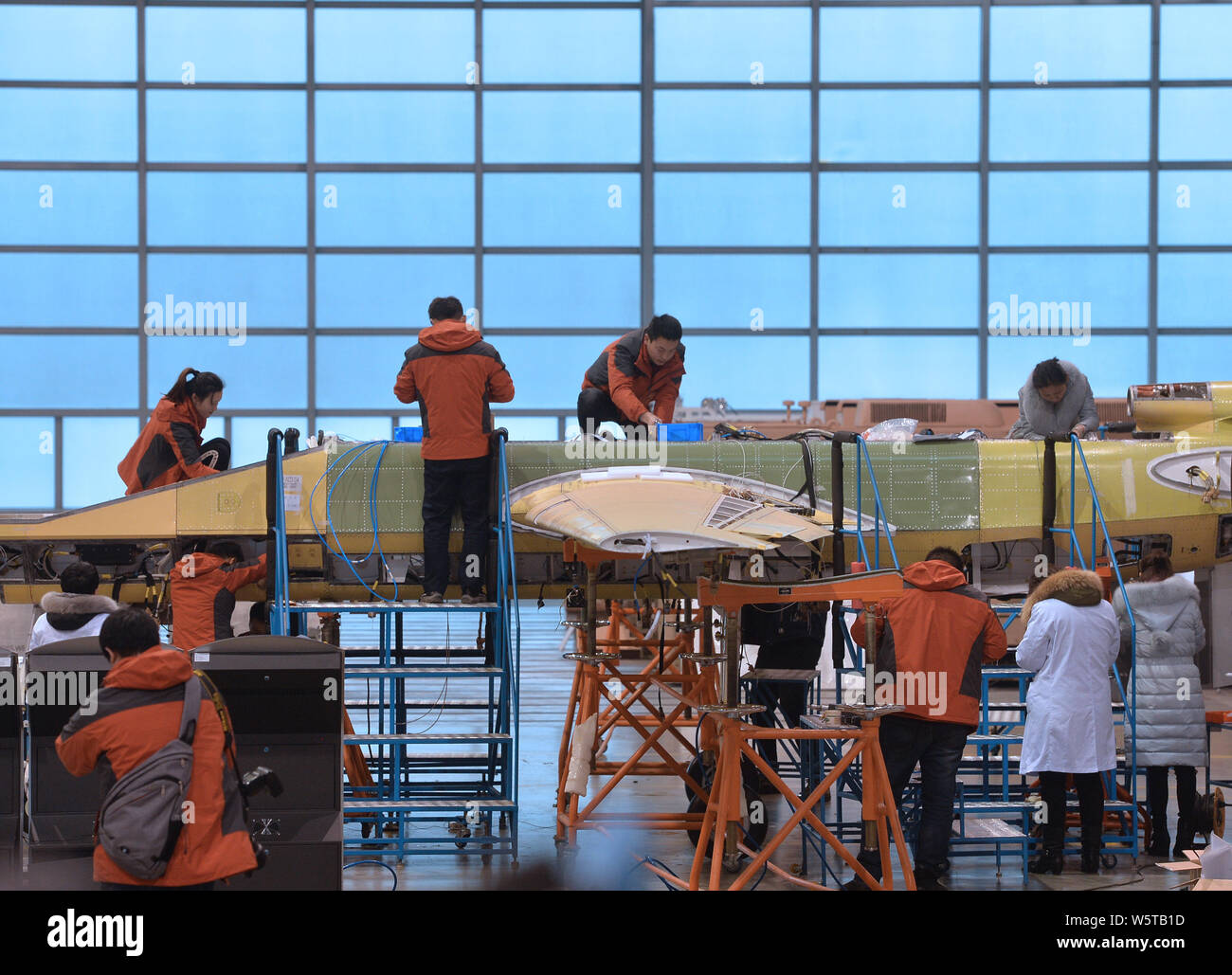 --FILE--Chinese workers assemble a Wing Loong unmanned aerial vehicle ...