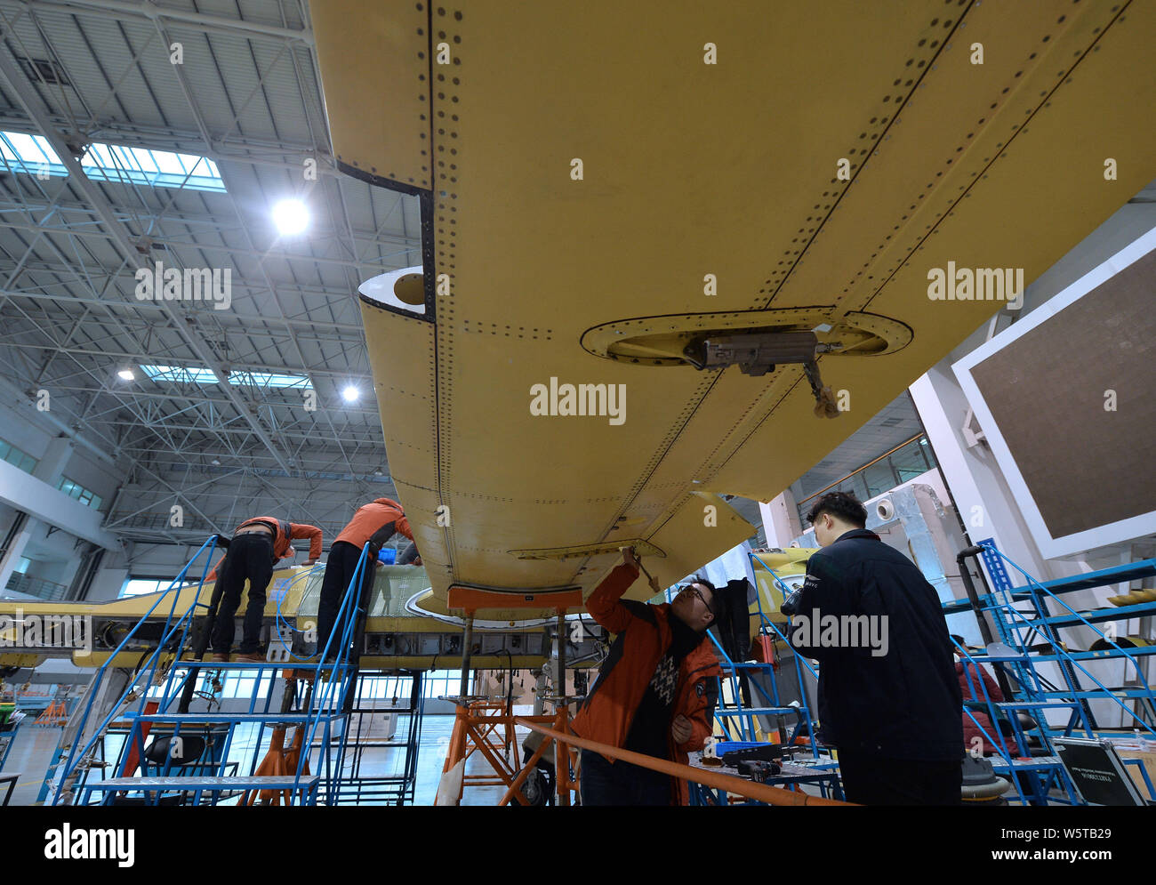 --FILE--Chinese workers assemble a Wing Loong unmanned aerial vehicle ...