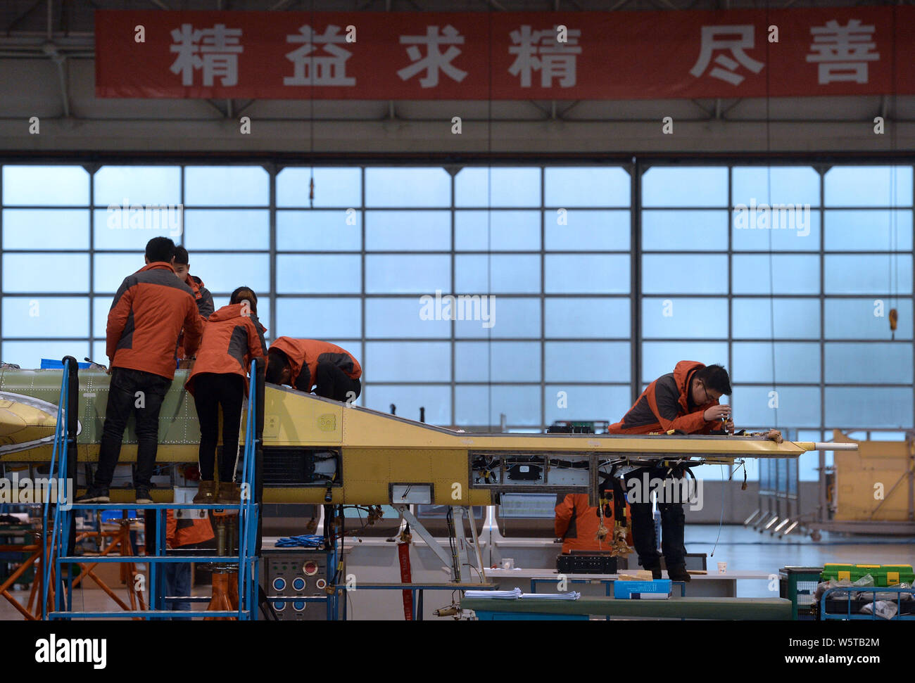 --FILE--Chinese workers assemble a Wing Loong unmanned aerial vehicle ...