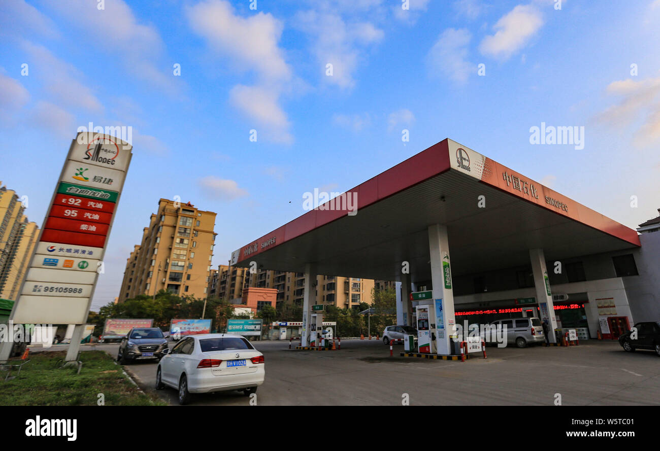 Cars are being refueled at a gas station of China Petroleum and ...