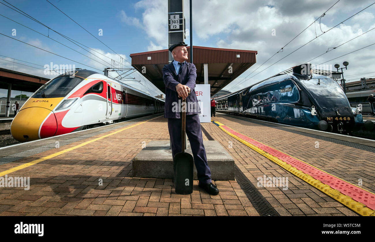 Steam traction inspector Jim Smith is pictured with a new Azuma train ...