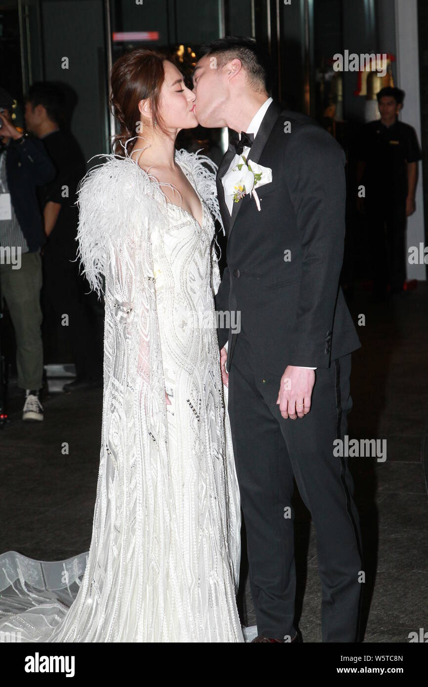 Hong Kong singer and actress Gillian Chung of pop duo Twins kisses her ...