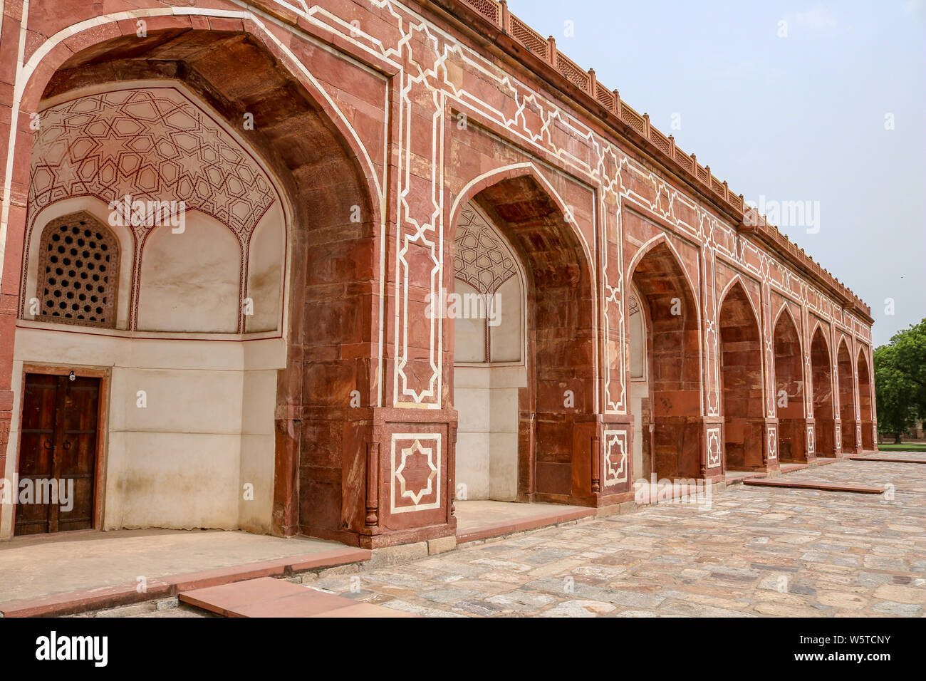 symmetrical arches at the base of Humayun's Tomb, New Delhi, India ...