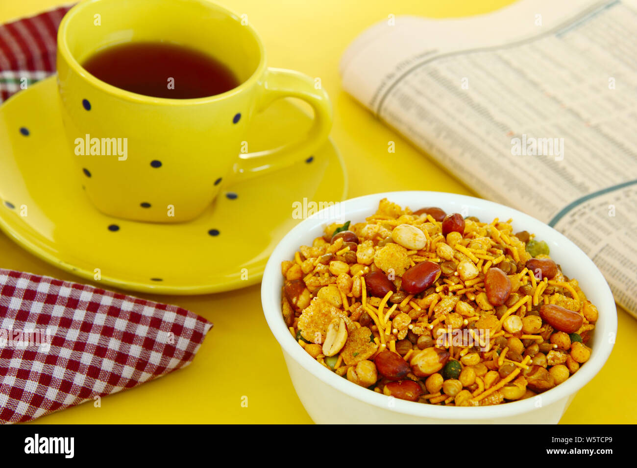 Mixture namkeen with black tea Stock Photo - Alamy