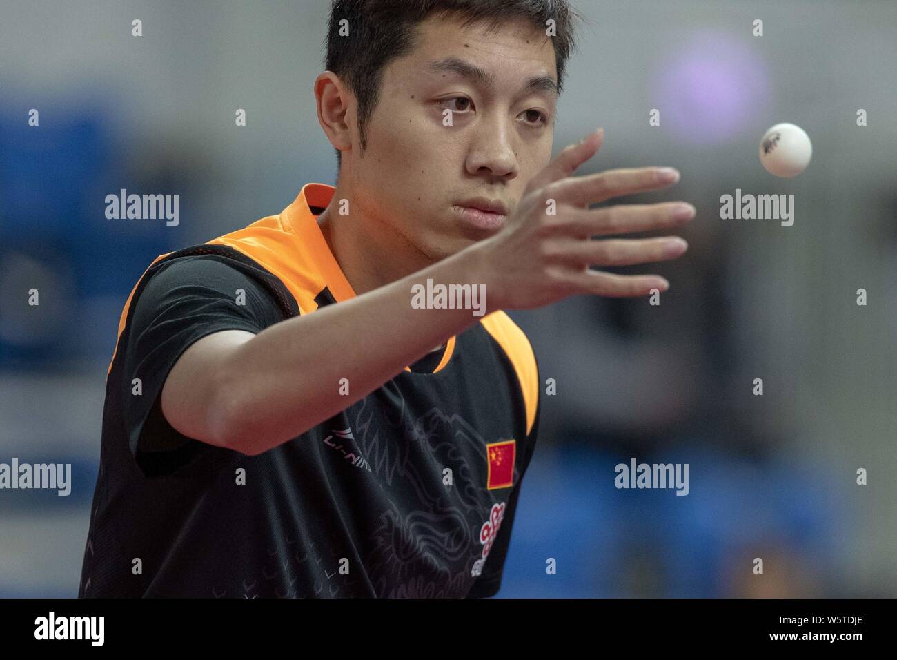 Xu Xin of China serves against Wong Chun Ting of Hong Kong in their men ...